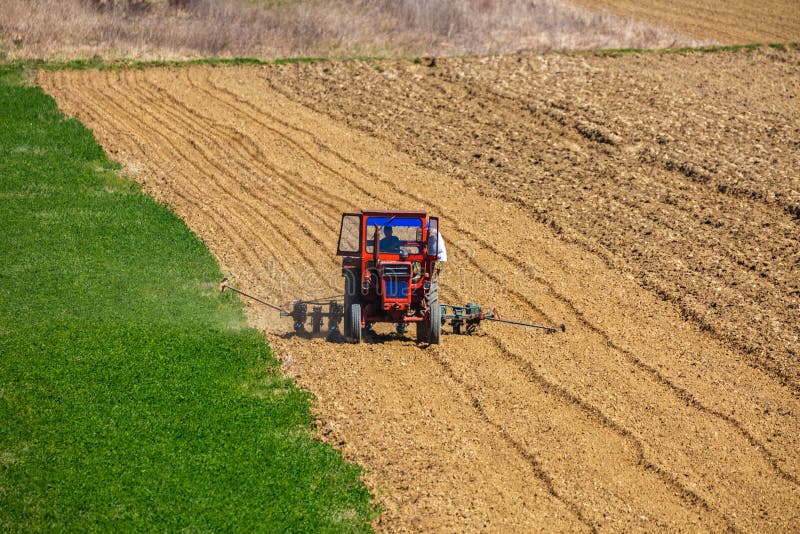 Tractor working in a field stock image. Image of equipment - 89952401