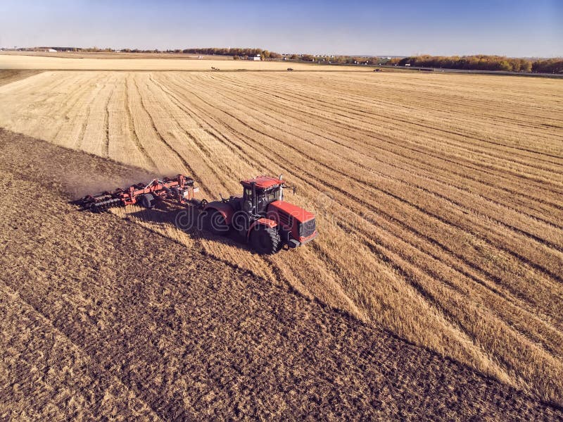 Tractor Working on the Farm, a Modern Agricultural Transport, a Farmer ...