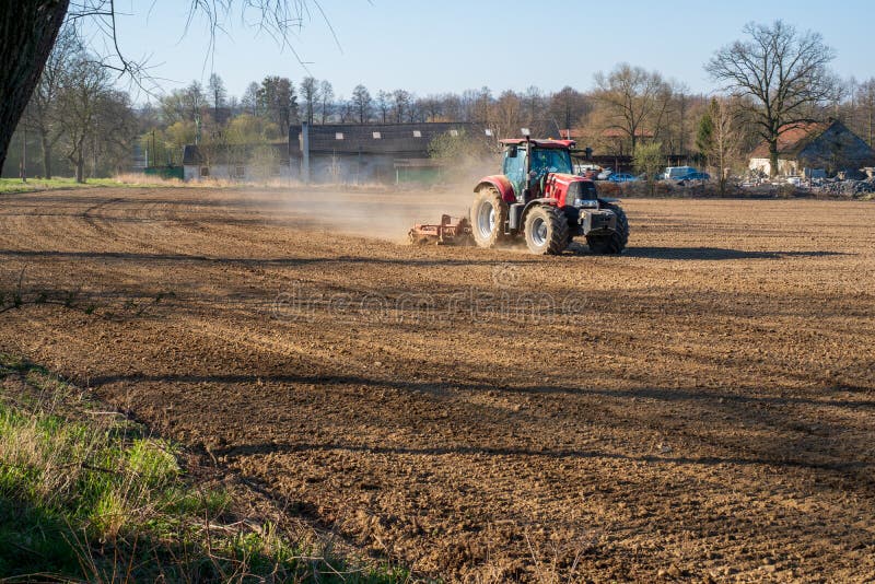 Tractor Working on the Harvest Field, Czech Stock Image - Image of ...