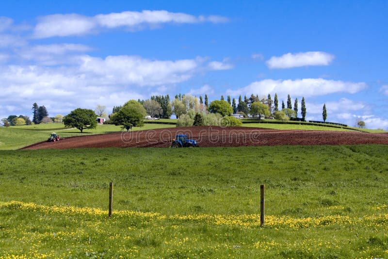 Tractors Working On The Spring Ploughland Stock Image - Image of grass ...