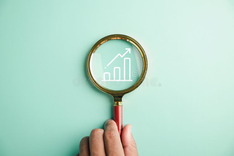 Trader Hand Holding Magnifier Glass with Bar Graph Stock Image - Image ... Trader Hand Holding Magnifier Glass with Bar Graph Stock Image - Image ...