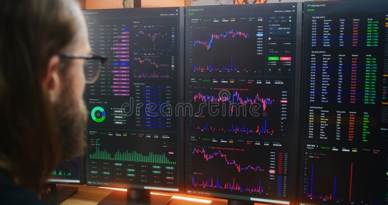 Trader Looks at Computer Screen, Works Remotely at Home Office Stock ...