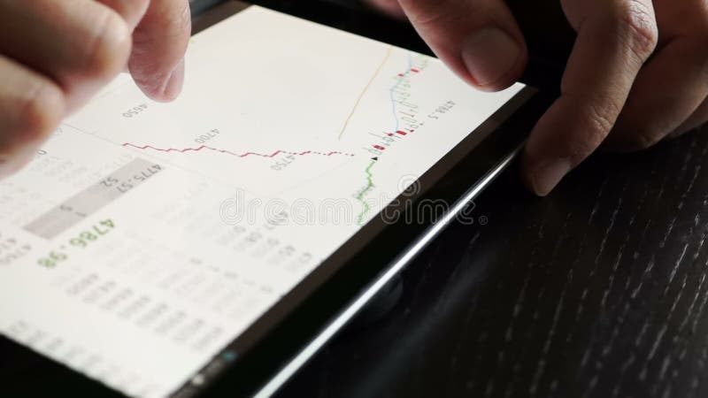 Trader Using Tablet for Checking Stock Data. Stock Video - Video of ...