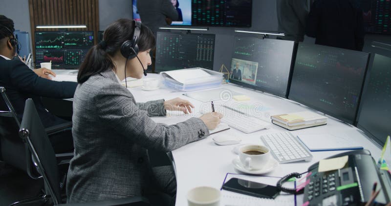 Female Trader Writes in Notepad and Work Stock Image - Image of analyze ...