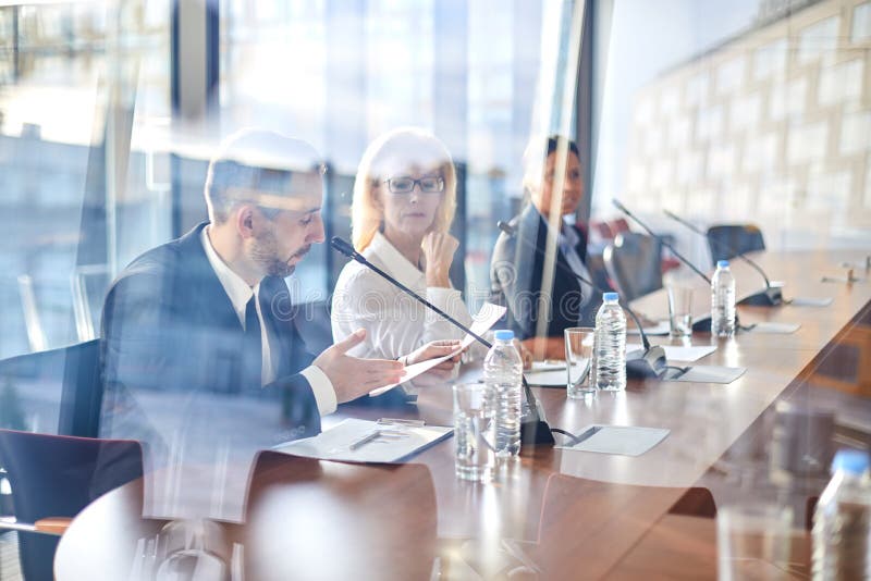 Traders discussing paper stock image. Image of professional - 139221839