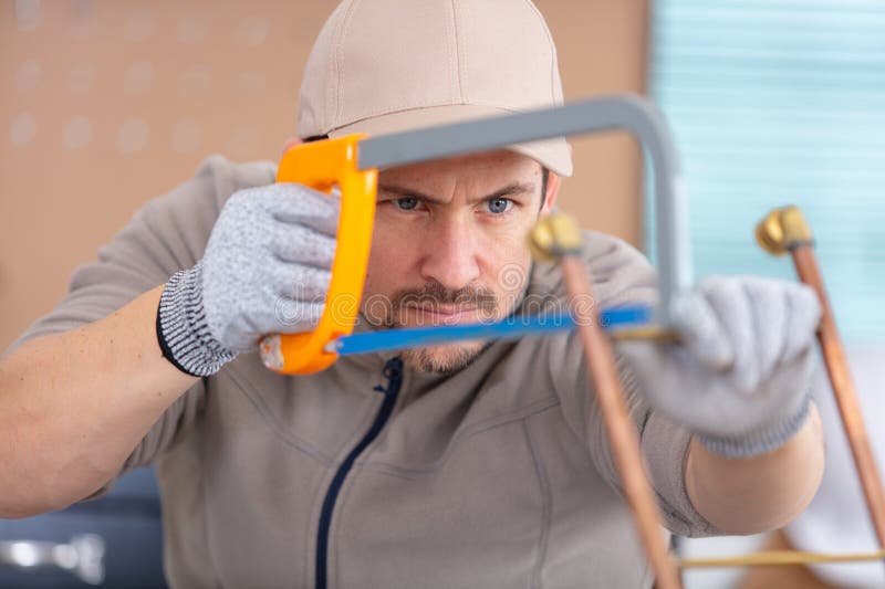 Tradesman Cutting Copper Pipe with Hacksaw Stock Image - Image of ...