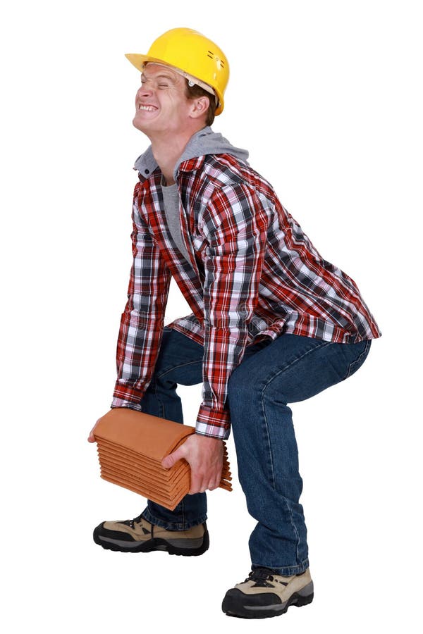 Tradesman Lifting a Heavy Load Stock Image - Image of labor, exertion ...