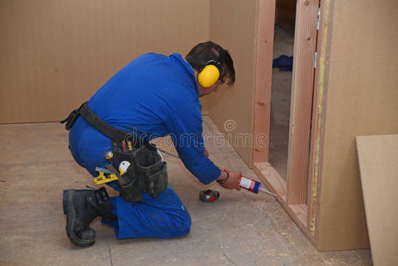 Tradesman Placing Wall Boards Stock Photo - Image of room, occupation ...