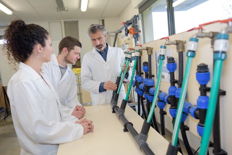 Tradesman Training Two Apprentices Stock Photo - Image of education ...