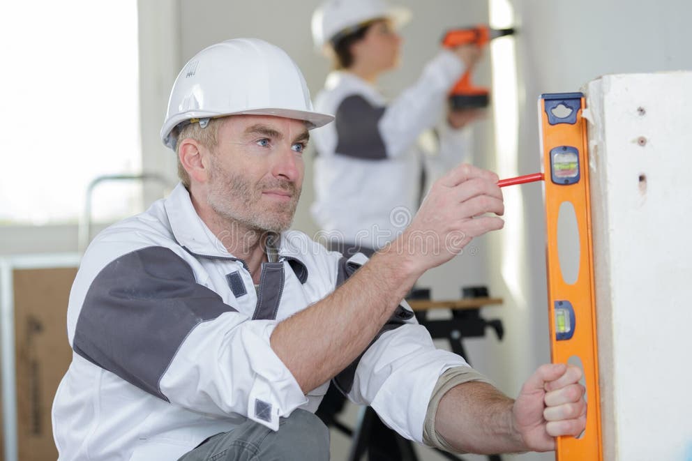 Tradesman Using Spirit Level Vertically Stock Photo - Image of accuracy ...