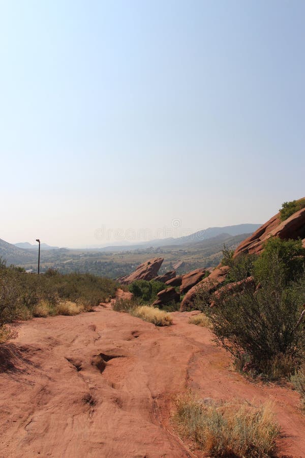 Trading Post Trail Lined with Large Rock Formations and Vegetation with ...