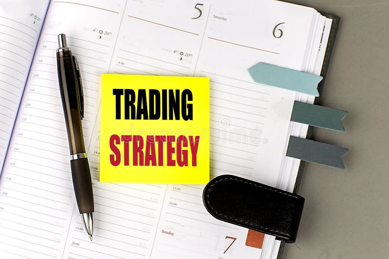 Trading Strategy Concept with Planner, Yellow Sticky Note, Pen, and ...