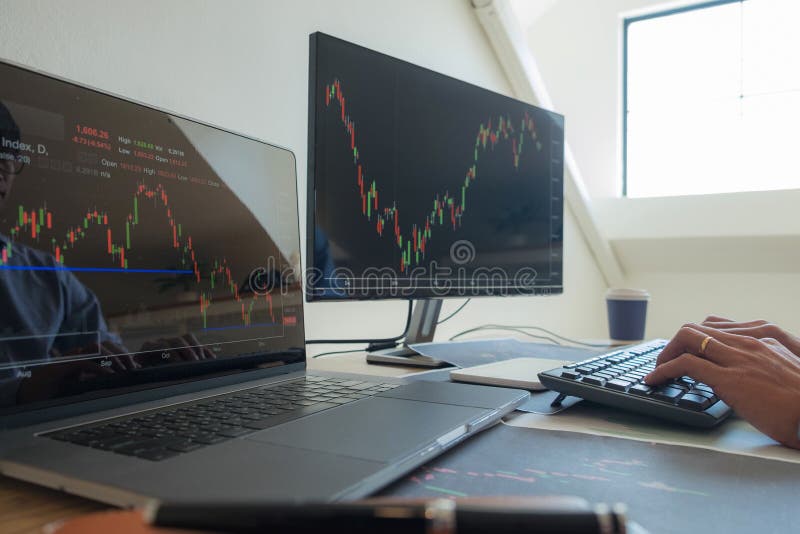Trading on the Table is Working on a Computer Screen Full of Charts and ...