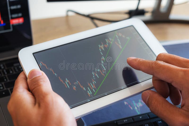 Trading on the Table is Working on a Computer Screen Full of Charts and ...
