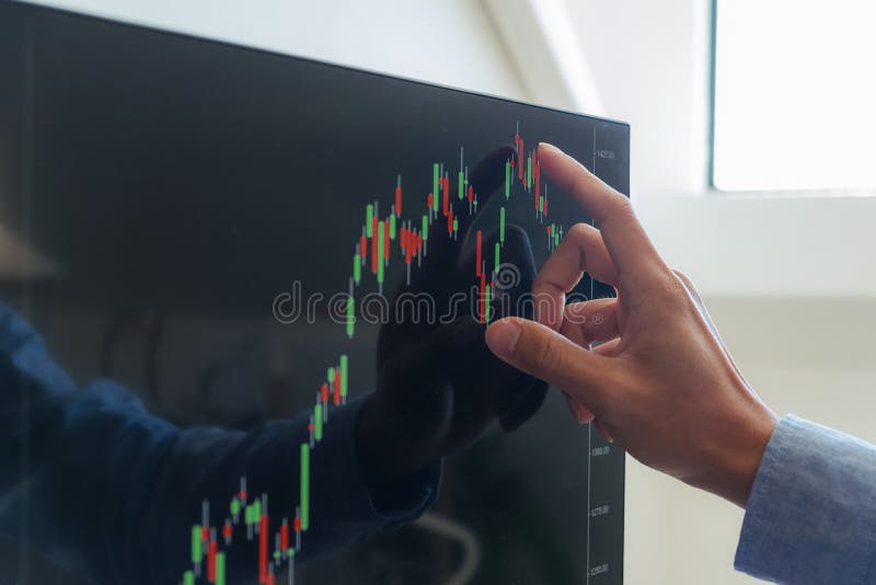 Trading on the Table is Working on a Computer Screen Full of Charts and ...