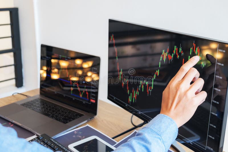 Trading on the Table is Working on a Computer Screen Full of Charts and ...