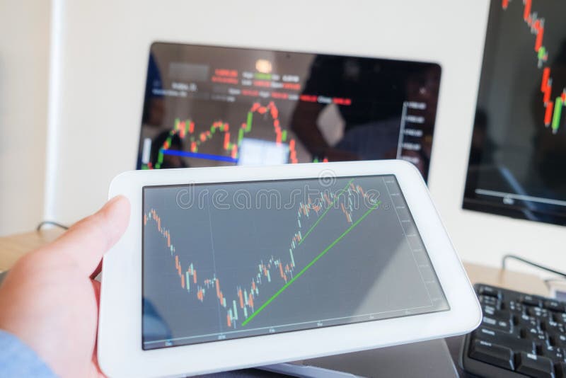 Trading on the Table is Working on a Computer Screen Full of Charts and ...