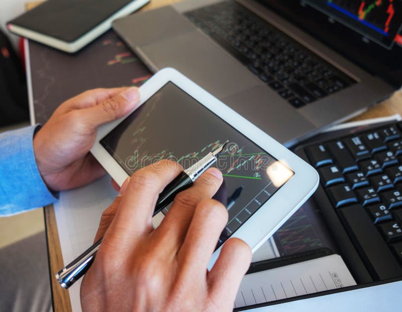 Trading on the Table is Working on a Computer Screen Full of Charts and ...