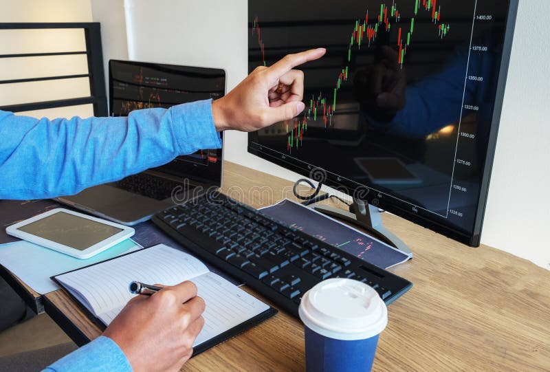 Trading on the Table is Working on a Computer Screen Full of Charts and ...