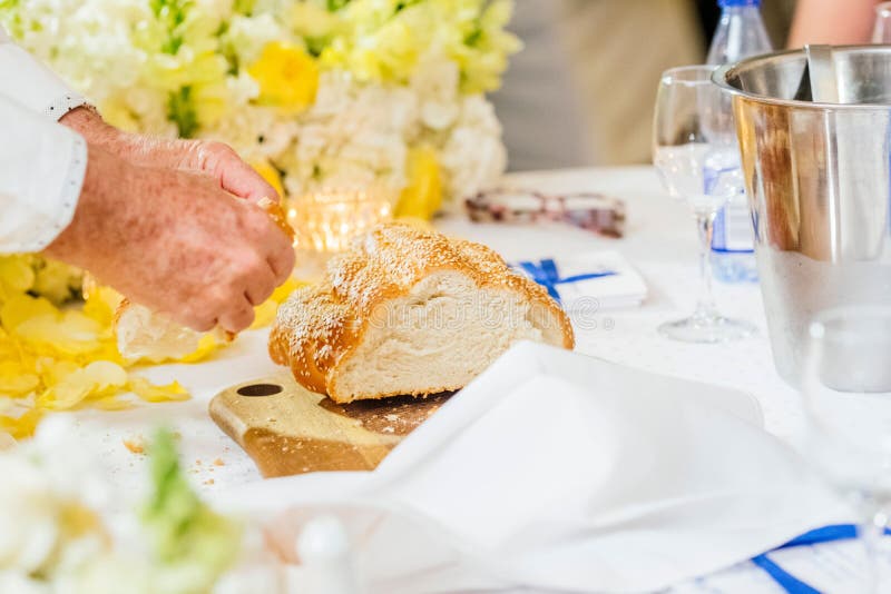 Tradition of Cutting and Taking a Bite of Challah Bread during a ...