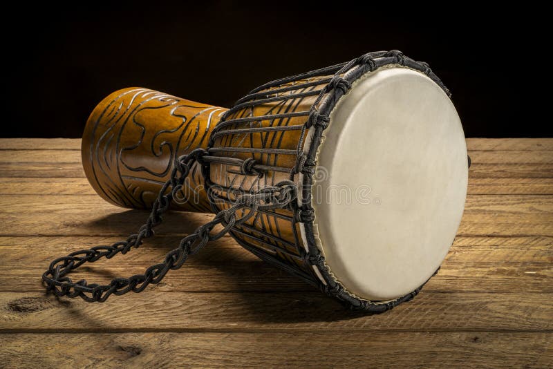 Traditional African Djembe Drum on a Rustic Wood Stock Photo - Image of ...