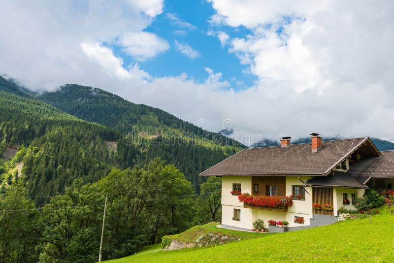 Traditional Alpine House in Green Forest Mountains Stock Photo - Image ...