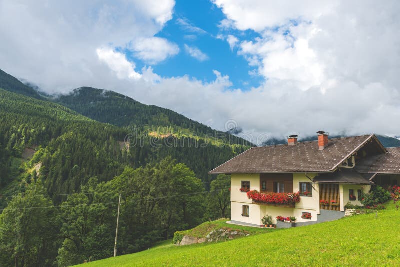 Traditional Alpine House in Green Forest Mountains Stock Image - Image ...