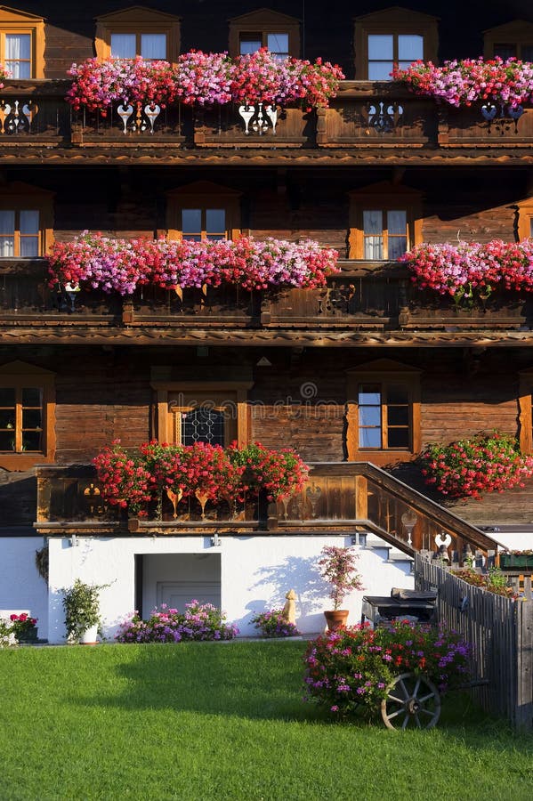 Traditional alpine house stock photo. Image of glass - 65878128