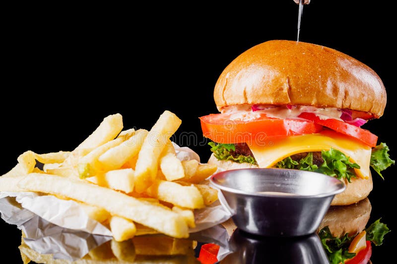 Traditional American Burger on a Black Background Stock Image - Image ...
