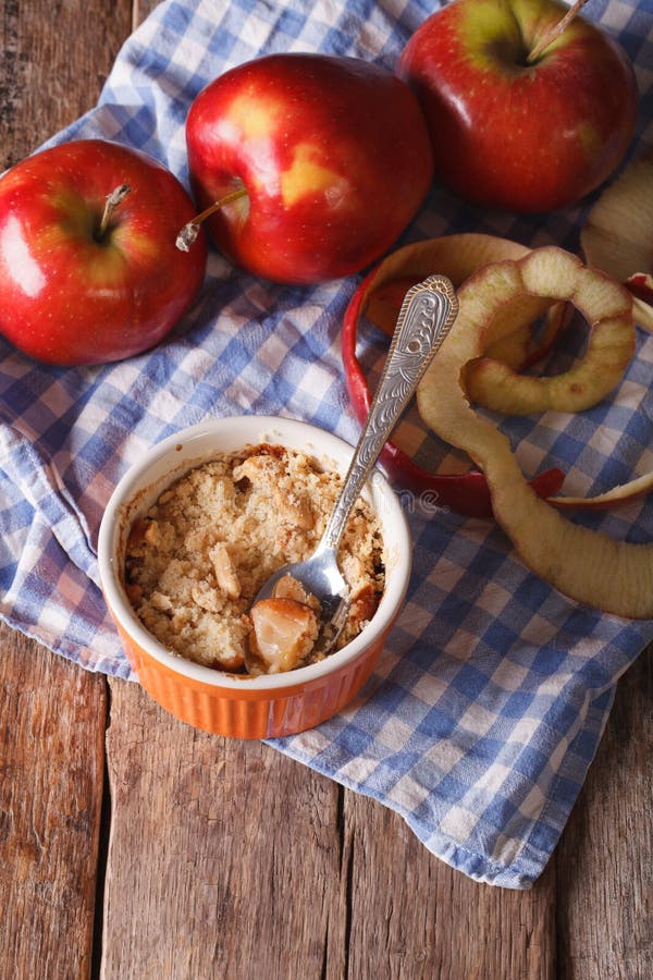 Traditional Apple Crumble Close-up in a Pot, Vertical Stock Image ...