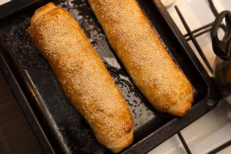 Traditional Apple Strudel Pie with Sesame on Baking Pan Stock Photo ...