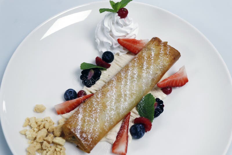 Traditional Apple Strudel with Whip Cream and Fresh Mix Berries Stock ...