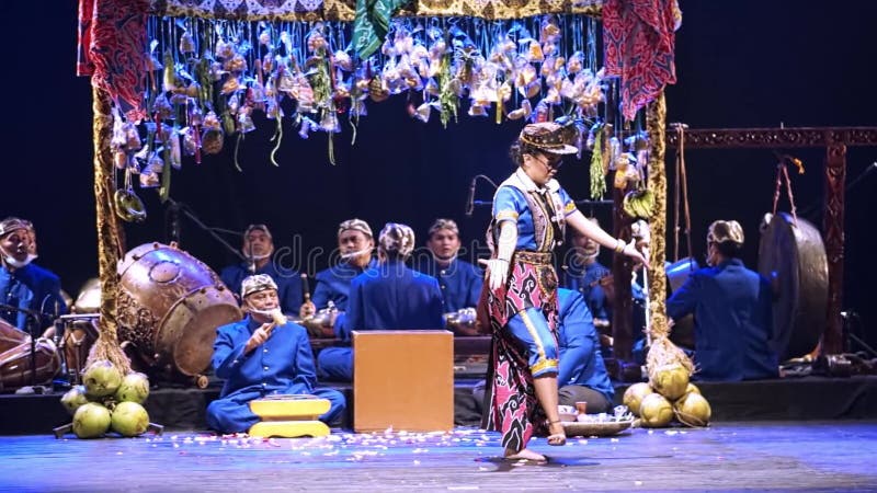 Traditional Asian Performance on Stage with Musicians and a Dancer in ...