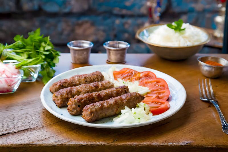 A Traditional Balkan Dish, Cevapi, Served with Fresh Vegetables and ...