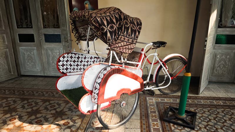 Traditional Becak Tricycle Adorned with Batik Patterns in an Indonesian ...