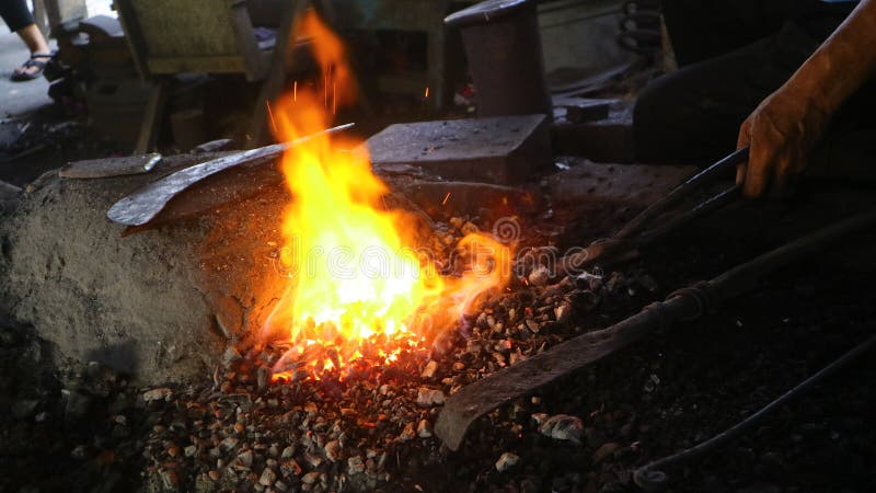 Traditional Blacksmithing: the Process of Forging Metal Over Fire Stock ...