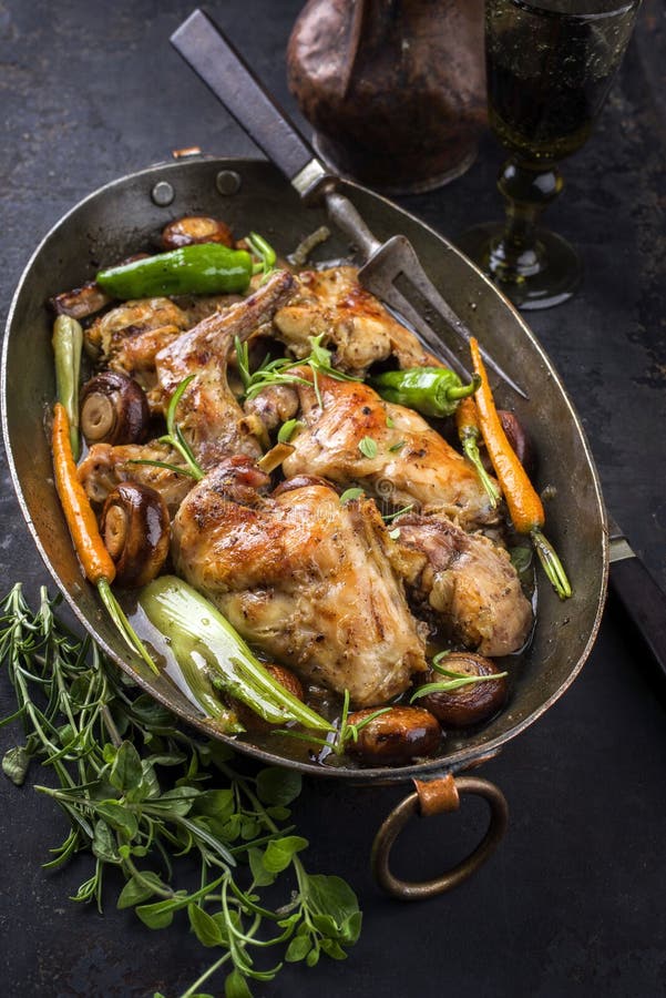 Traditional Braised Rabbit with Vegetable and Mushrooms in a Rustic ...