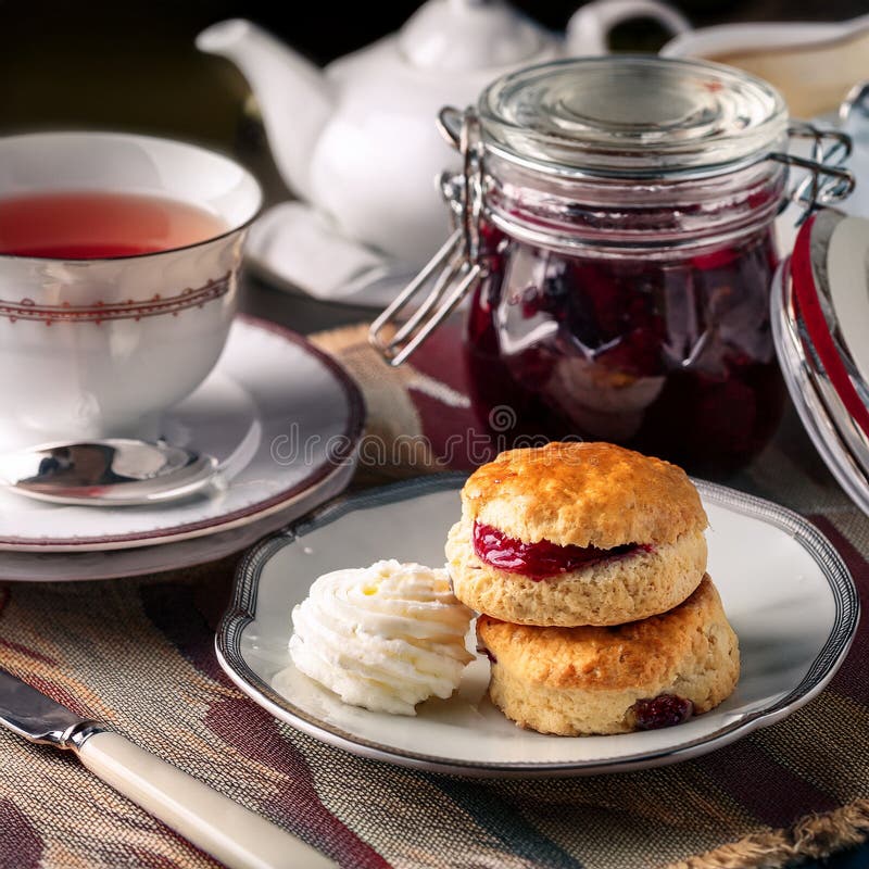 A Traditional British Afternoon Tea Setup with Assorted Pastries and ...