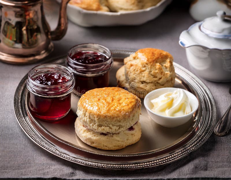 A Traditional British Afternoon Tea Setup with Assorted Pastries and ...
