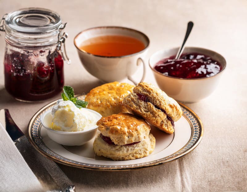 A Traditional British Afternoon Tea Setup with Assorted Pastries and ...