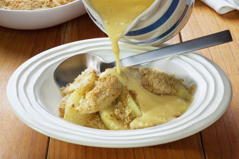 Apple crumble with custard stock image. Image of dessert - 18910709