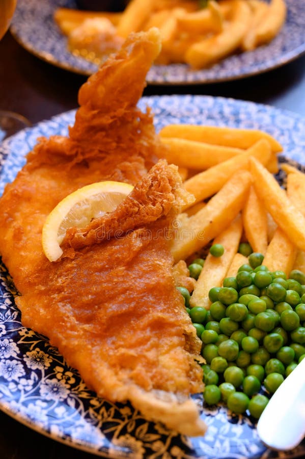 Traditional British Food Fish and Chips Served with Green Peas Stock ...