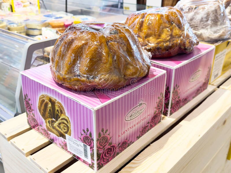 Traditional Bundt Cakes in Plastic Wrap on Display in Grocery Store ...