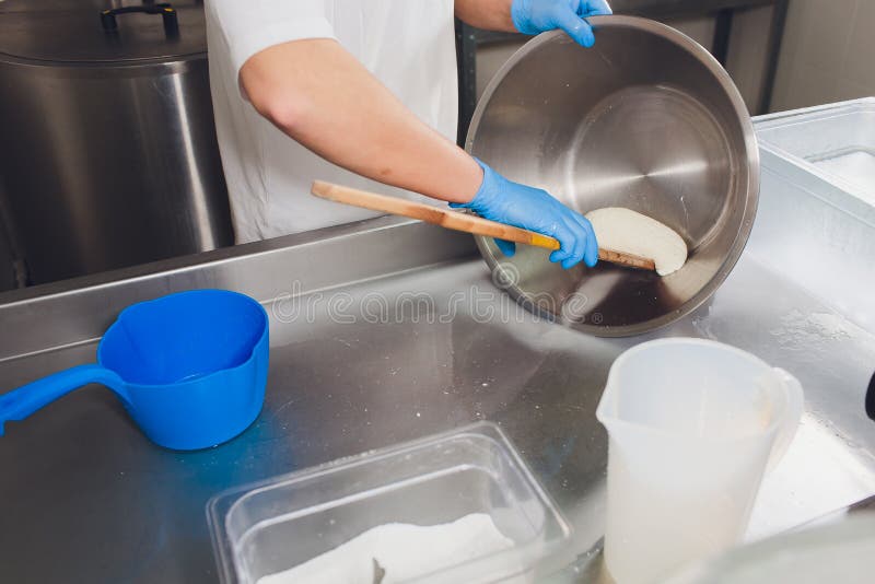 Traditional Cheese Making in a Small Company. Cheese Maker Hands Close ...