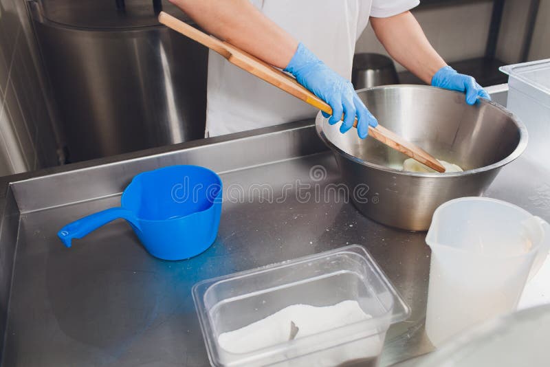 Traditional Cheese Making in a Small Company. Cheese Maker Hands Close ...