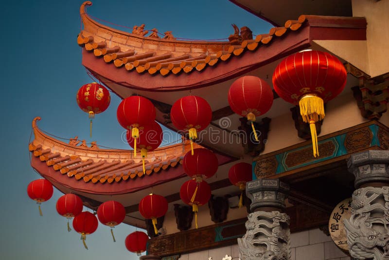 A Chinese Styled Structure with Red Lanterns and Stone Columns in it ...