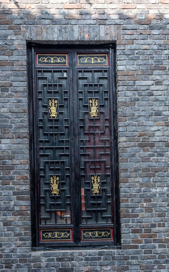 Traditional Chinese Style Windows Against Brick Wall Stock Photo ...