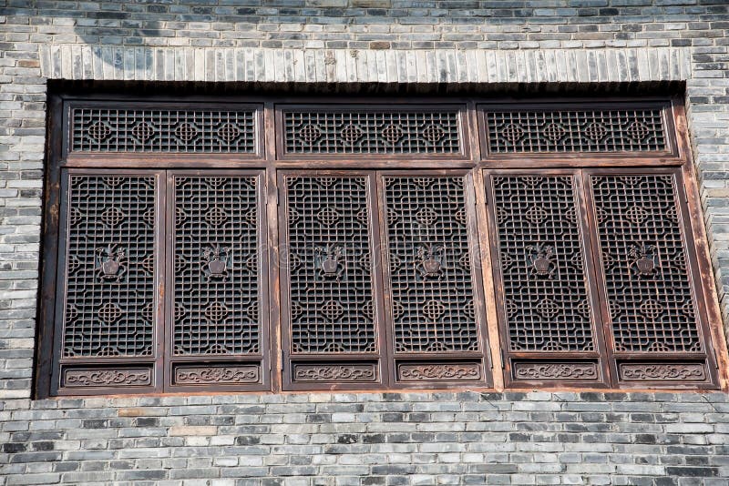 Traditional Chinese Style Windows Against Brick Wall Stock Photo ...