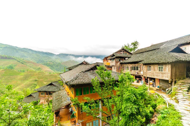 Traditional Chinese Wodden House in the Rice Fields by Longsheng Stock ...