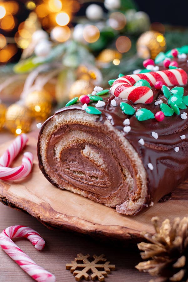 Traditional Chocolate Trunk Cake or Log Cake on Table with Christmas ...